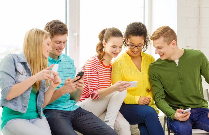 Smiling Students with Smartphone Texting at School Stock Photo - Image ...