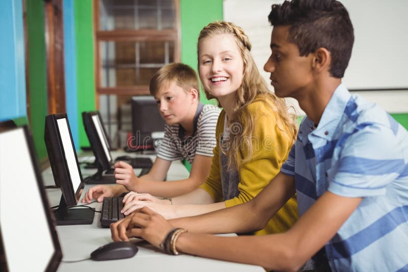 Smiling Students Studying in Computer Classroom Stock Photo - Image of ...
