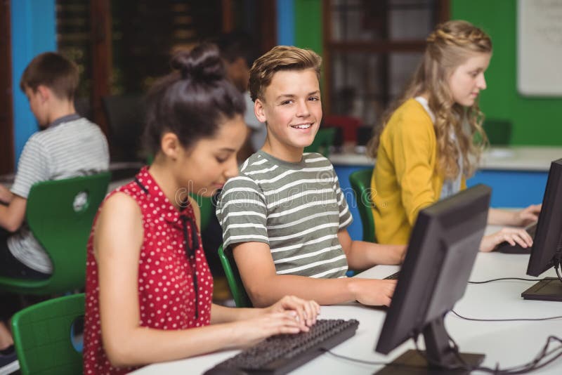 Smiling Students Studying in Computer Classroom Stock Photo - Image of ...