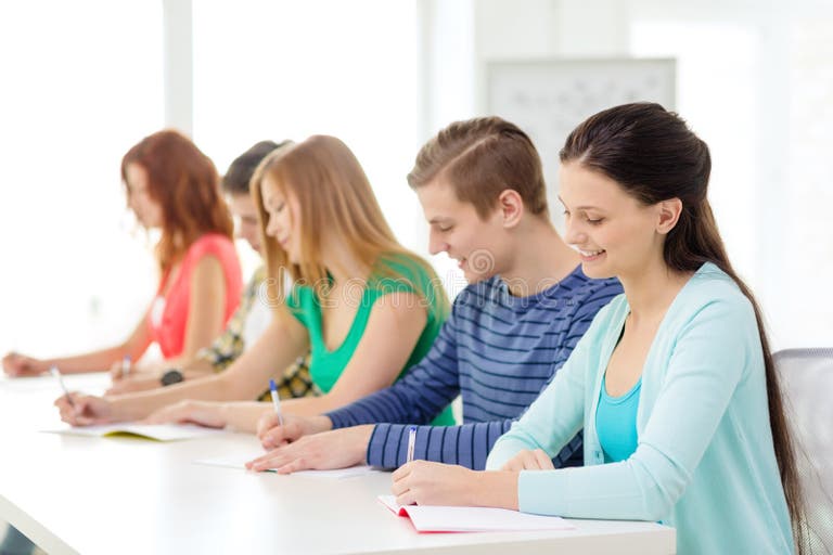 Smiling Students with Textbooks at School Stock Photo - Image of exam ...