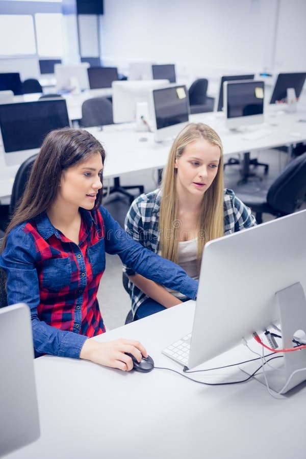 Smiling Students Using Computer Stock Image - Image of people, monitor ...