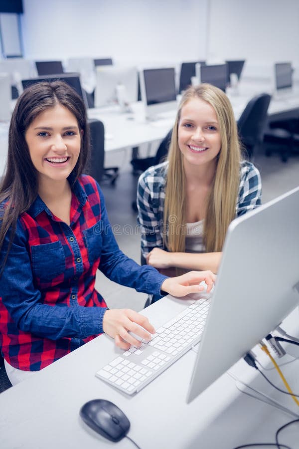 Smiling Students Using Computer Stock Image - Image of people, higher ...
