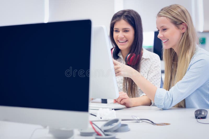 Smiling Students Using Computer Stock Image - Image of education ...