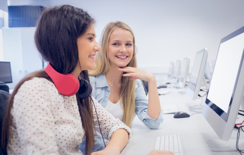 Smiling Students Using Computer Stock Image - Image of academic, desk ...