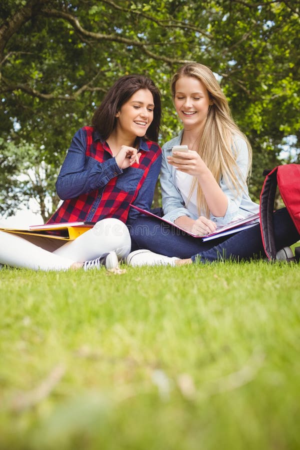 Smiling Students Using Smartphone Stock Image - Image of connection ...
