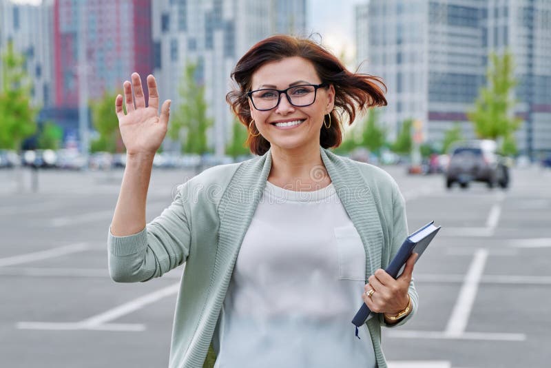 Smiling Successful Mature Business Woman Walking Outdoor, Modern Urban ... Smiling Successful Mature Business Woman Walking Outdoor, Modern Urban ...