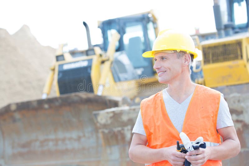 Smiling Supervisor Looking Away at Construction Site Stock Image ...