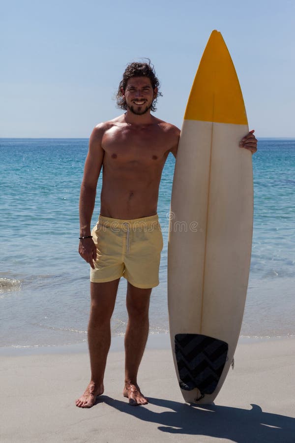 Smiling Surfer with Surfboard Standing at Beach Coast Stock Photo ...