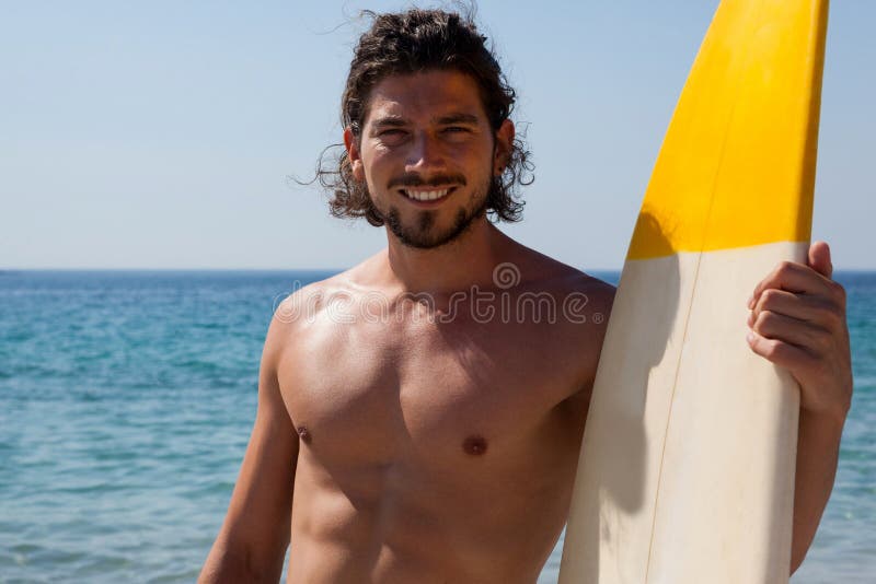 Smiling Surfer with Surfboard Standing at Beach Coast Stock Photo ...