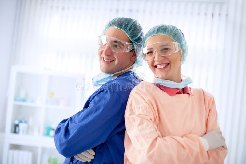 Smiling surgical team stock image. Image of illness, male - 64954629