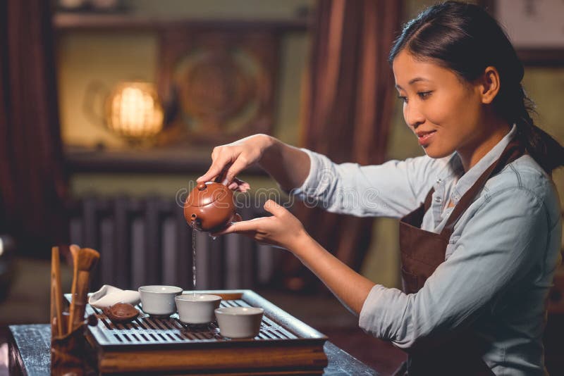 Smiling Tea Master Pouring Tea Stock Image - Image of room, human ...