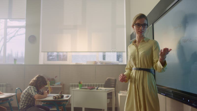 Teacher Explaining Lesson. Girl Drawing Task on Interactive Digital ...