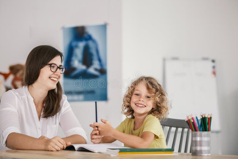 Smiling Teacher and Happy Kid Doing Homework after Classes Stock Image ...