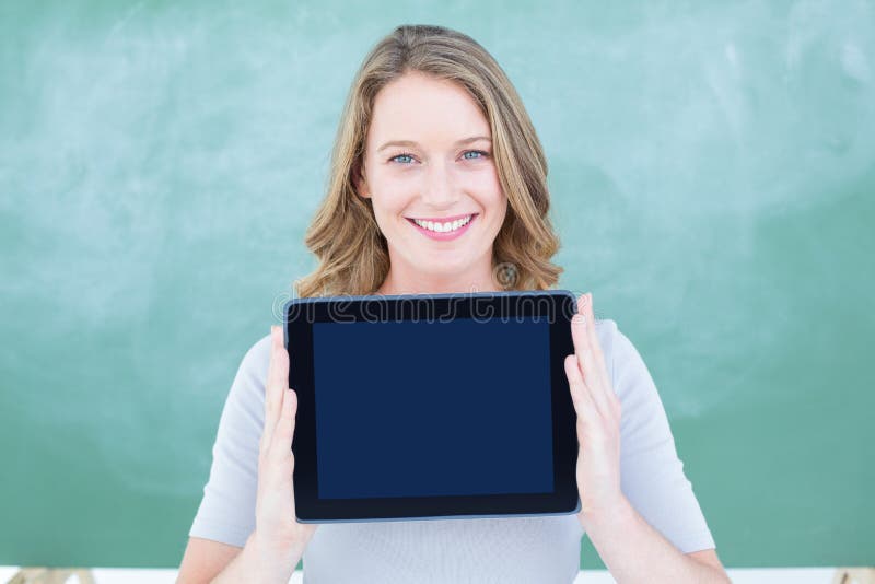 Smiling Teacher Holding Tablet Pc in Front of Blackboard Stock Image ...