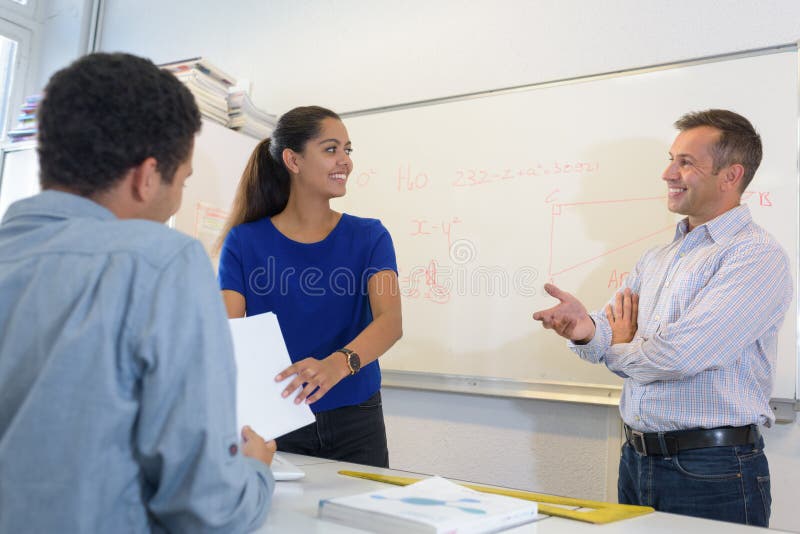 Smiling Teacher Standing Near Board with Students Stock Image - Image ...