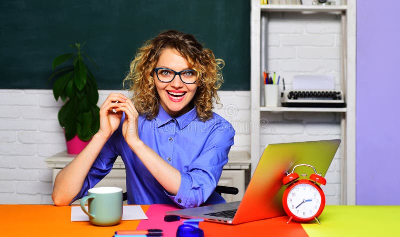 Smiling Teacher in Classroom. Female Lecturer with Book. School ...