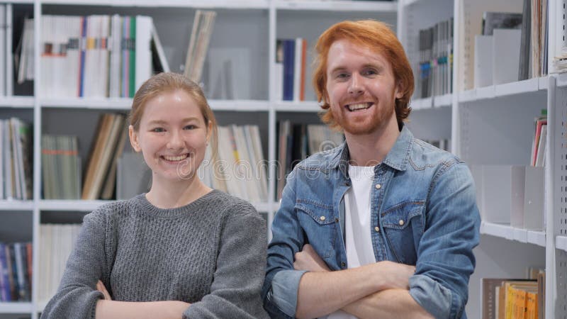 Smiling Team Members Looking at Camera in Office Stock Photo - Image of ...