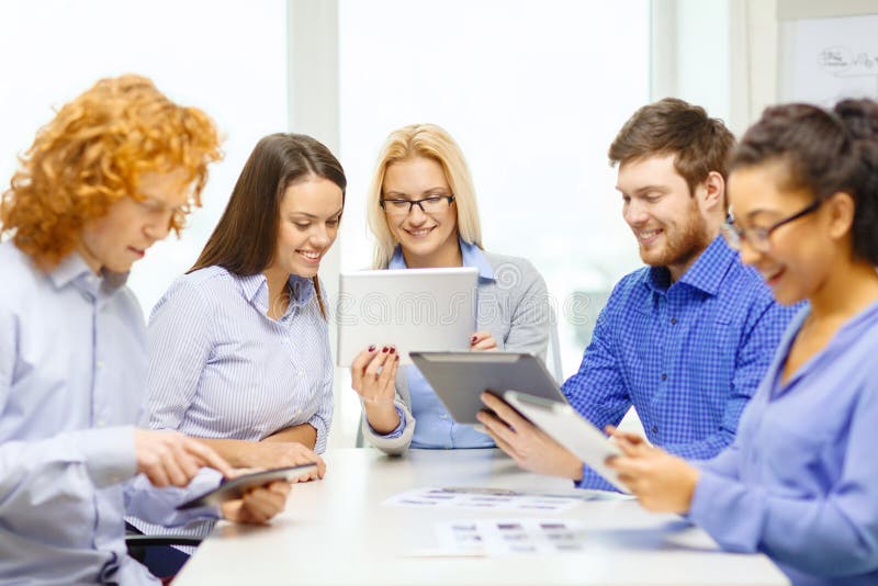 Smiling Team with Table Pc and Papers Working Stock Image - Image of ...