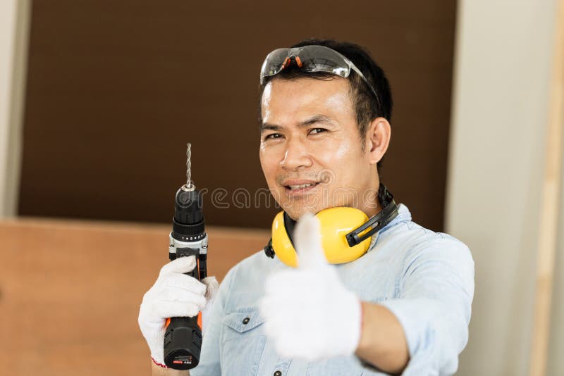 Smiling Technical Man Holding Electric Screwdriver with Showing Thumbs ...