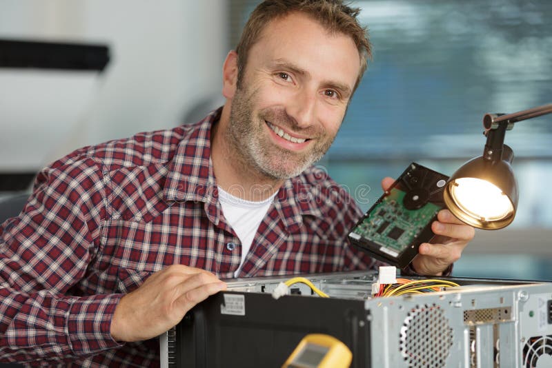 Smiling Technician Holding Computer Component Stock Photo - Image of ...