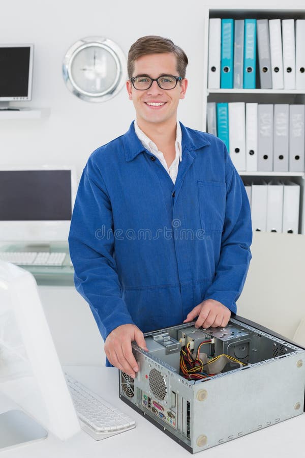 Smiling Technician Working on Broken Computer Stock Photo - Image of ...