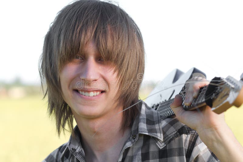Smiling Teenage Emo Guitarist Stock Image - Image of male, looking ...