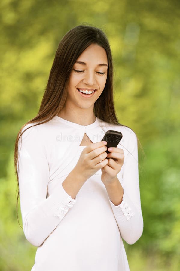 Smiling Teenage Girl Writes Text Stock Photo - Image of cute, call ...