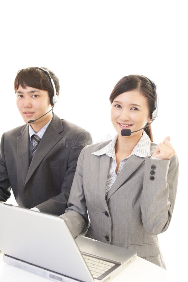 Smiling Telephone Operators Stock Photo - Image of headset, friendly ...