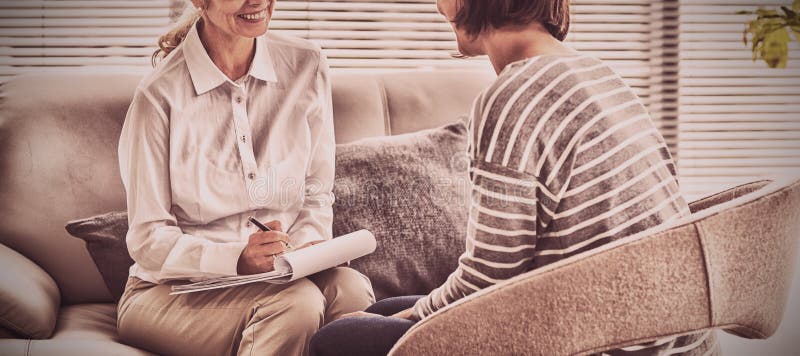 Smiling Therapist with Patient Stock Image - Image of notes ...