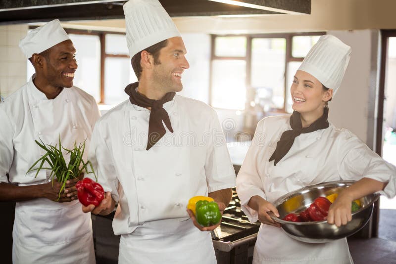 Smiling Three Chefs Holding A Vegetables Stock Photo - Image of hotel ...