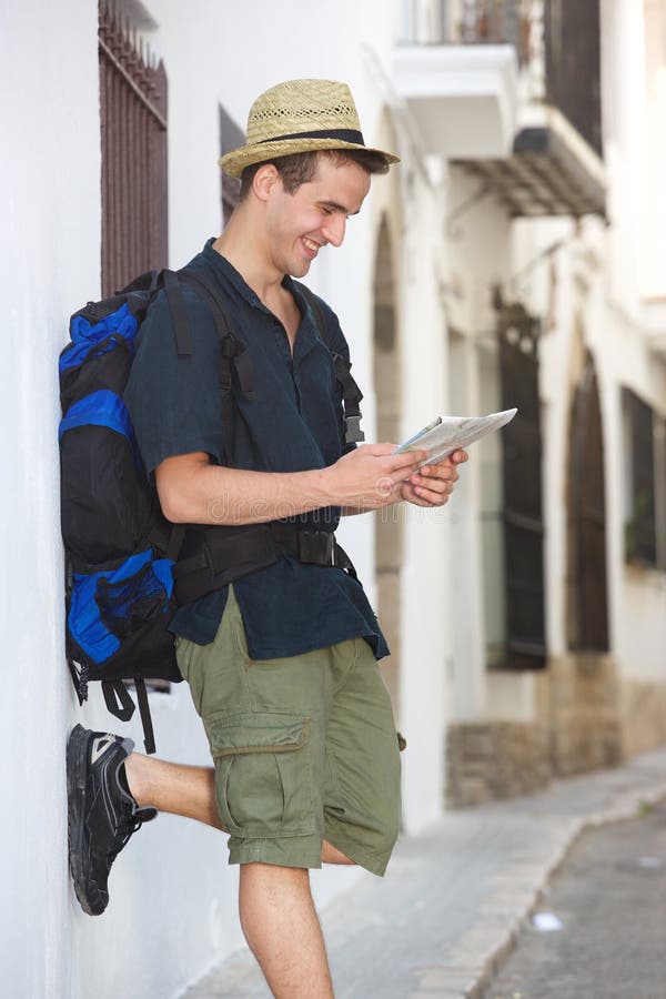 Smiling Travel Man Looking at Map Outside Stock Photo - Image of ...