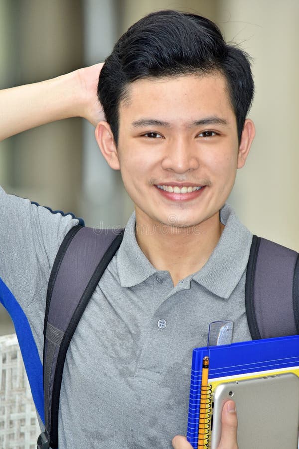Smiling University Filipino Boy Student with Notebooks Stock Photo ...