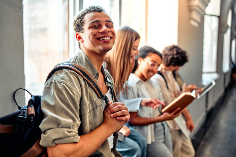 A Smiling University Student Stock Image - Image of backpack, college ...