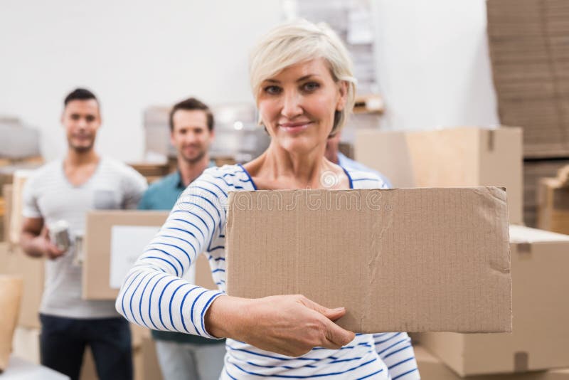 Smiling Volunteer Showing a Poster Stock Image - Image of freight ...