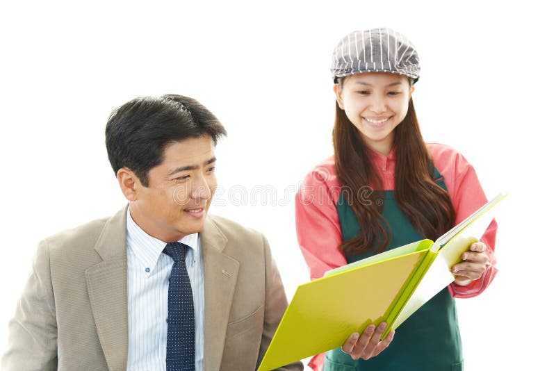 Smiling Waitress and a Customer Stock Photo - Image of menu, japanese ...