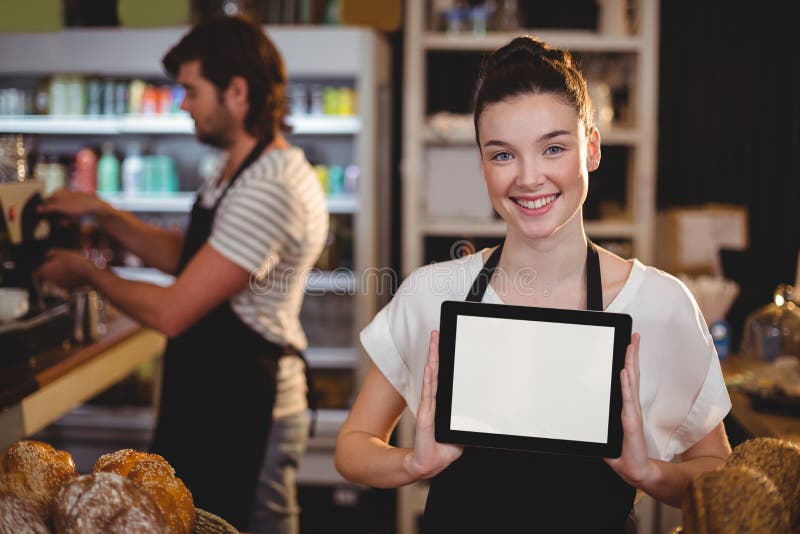 Smiling Waitress Showing Digital Tablet Stock Photo - Image of ...