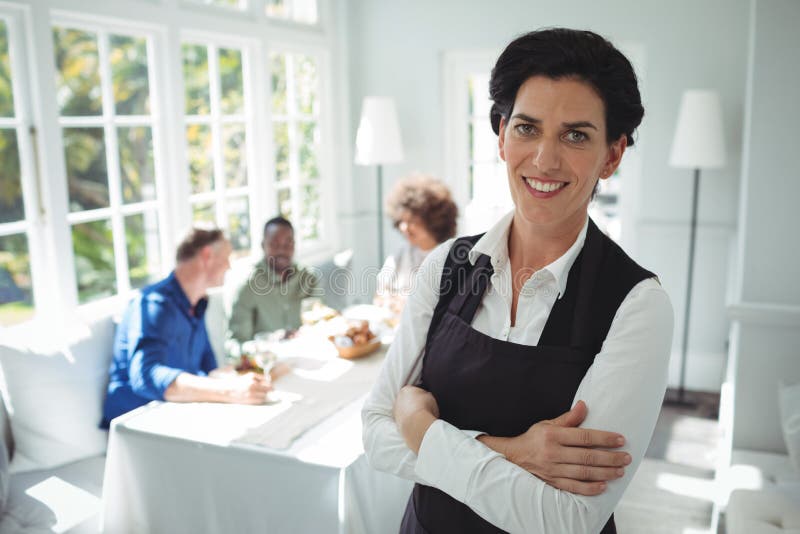 Smiling Waitress Standing with Arms Crossed Stock Image - Image of ...