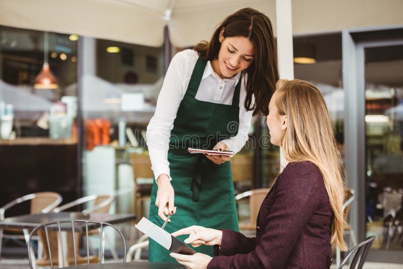 Smiling Waitress Taking an Order Stock Image - Image of communication ... Smiling Waitress Taking an Order Stock Image - Image of communication ...