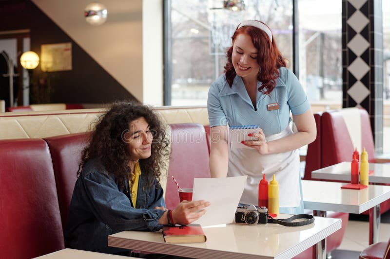 Smiling Waitress Taking Order from Customer in Diner Stock Image ...
