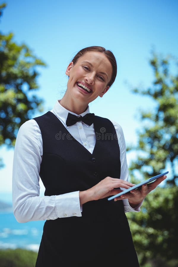 Smiling Waitress Taking an Order with a Tablet Stock Photo - Image of ...