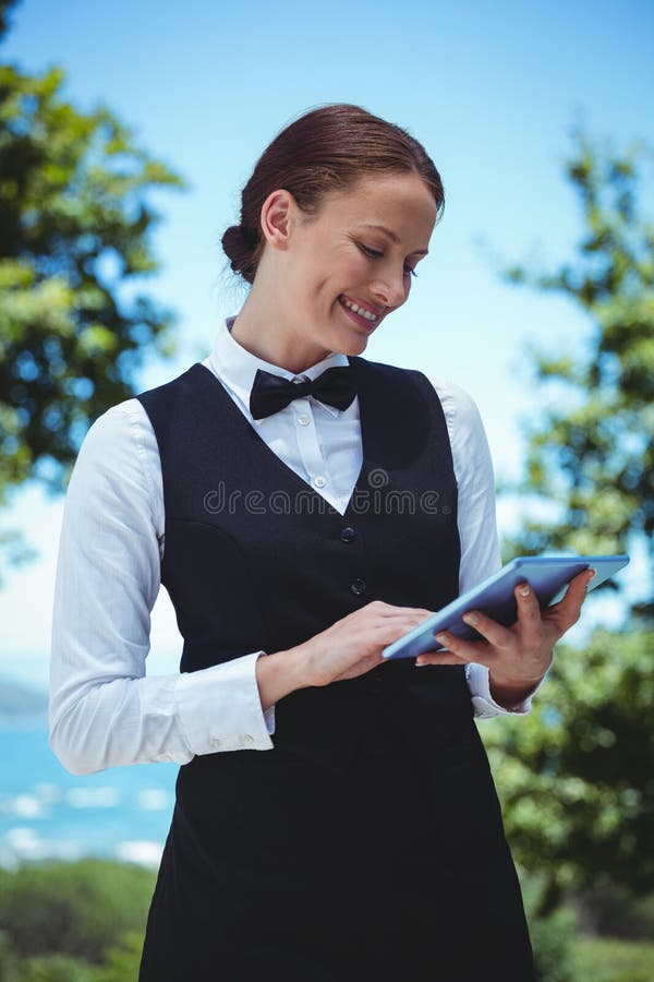 Smiling Waitress Taking an Order with a Tablet Stock Photo - Image of ...