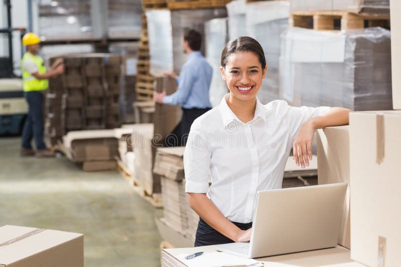 Smiling Warehouse Workers Preparing a Shipment Stock Photo - Image of ...