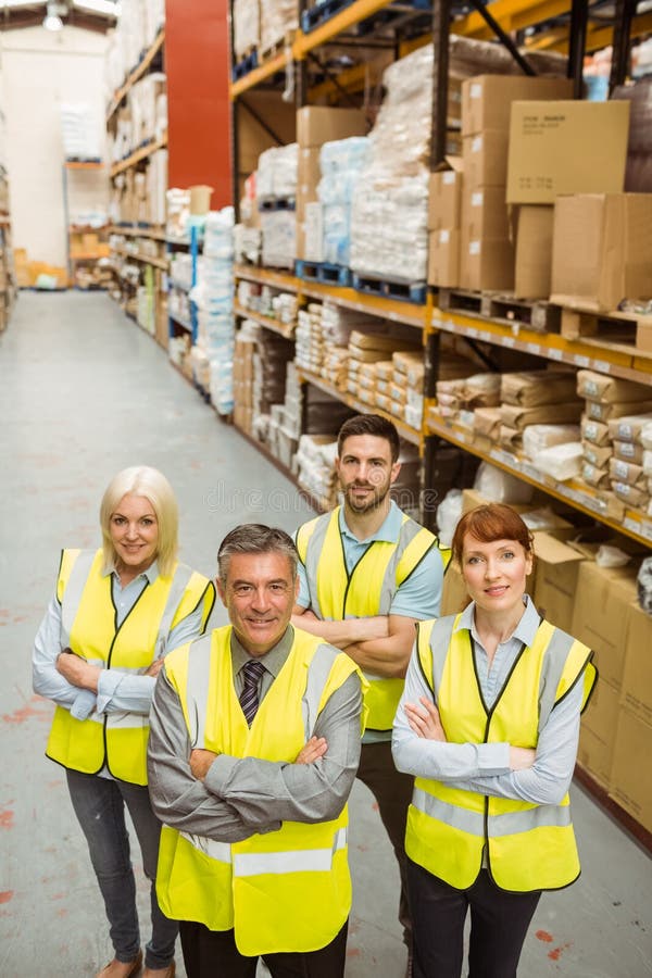 Smiling Warehouse Team with Arms Crossed Stock Photo - Image of ...