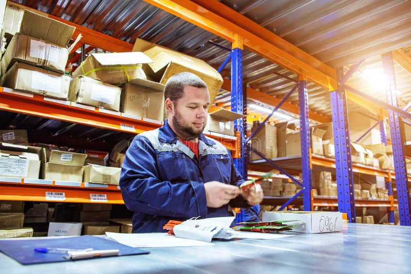 Smiling Warehouse Worker Checking Items in a Box, Preparing Goods for Shipping Stock Image ...