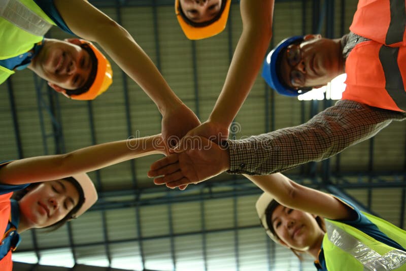 Smiling Warehouse Workers Team Stacking Hands Together Bottom View ...