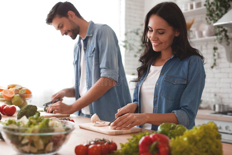 Smiling Wife and Husband Cooking Dinner in the Kitchen Together Stock ...