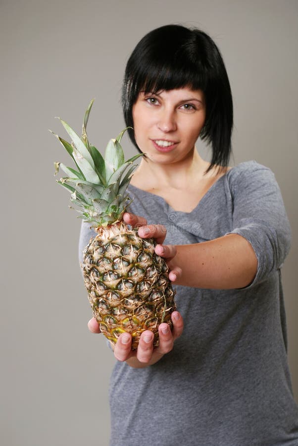 Smiling woman with ananas stock image. Image of adult - 24257485