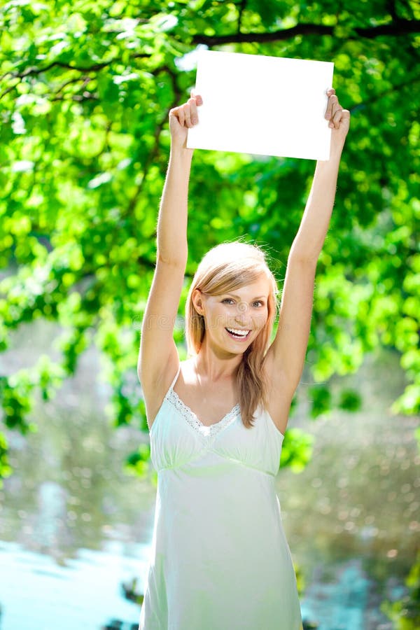 Smiling Woman with Blank Poster Outdoors Stock Photo - Image of advert ...