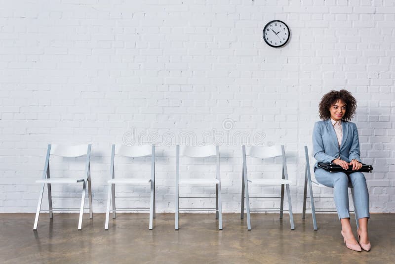 Smiling Woman with Briefcase Waiting for Interview while Sitting Stock ...