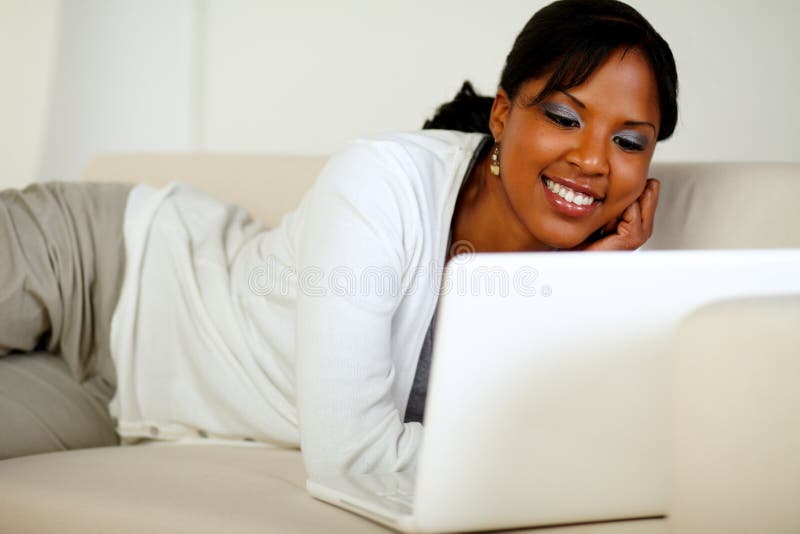 Smiling Woman Browsing the Internet on Laptop Stock Photo - Image of ...